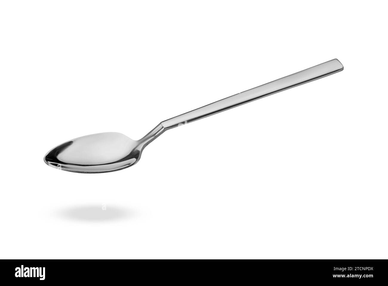 Silver spoon in air isolated on white Stock Photo - Alamy