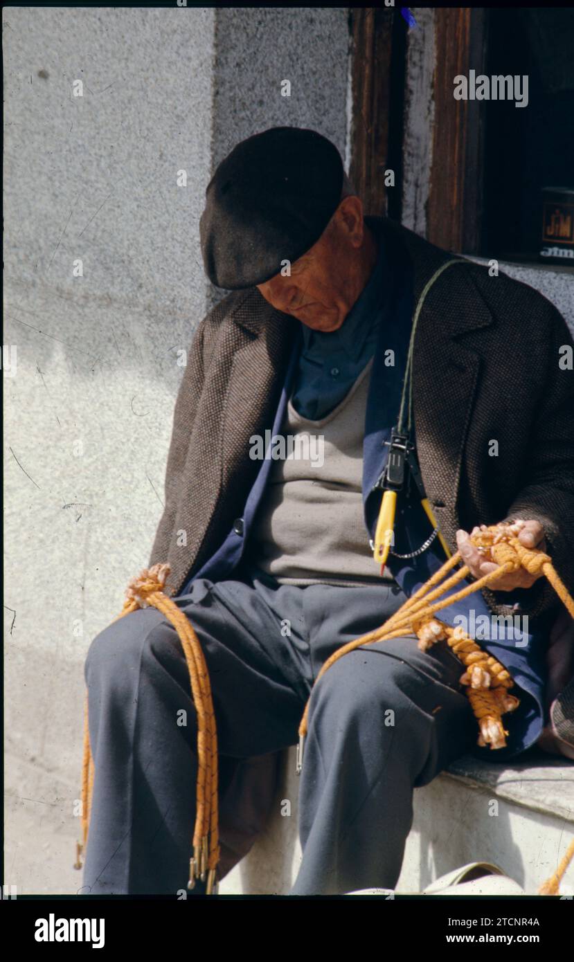 Toledo, May 1974. An elderly seller of lighters and wicks sleeping in ...