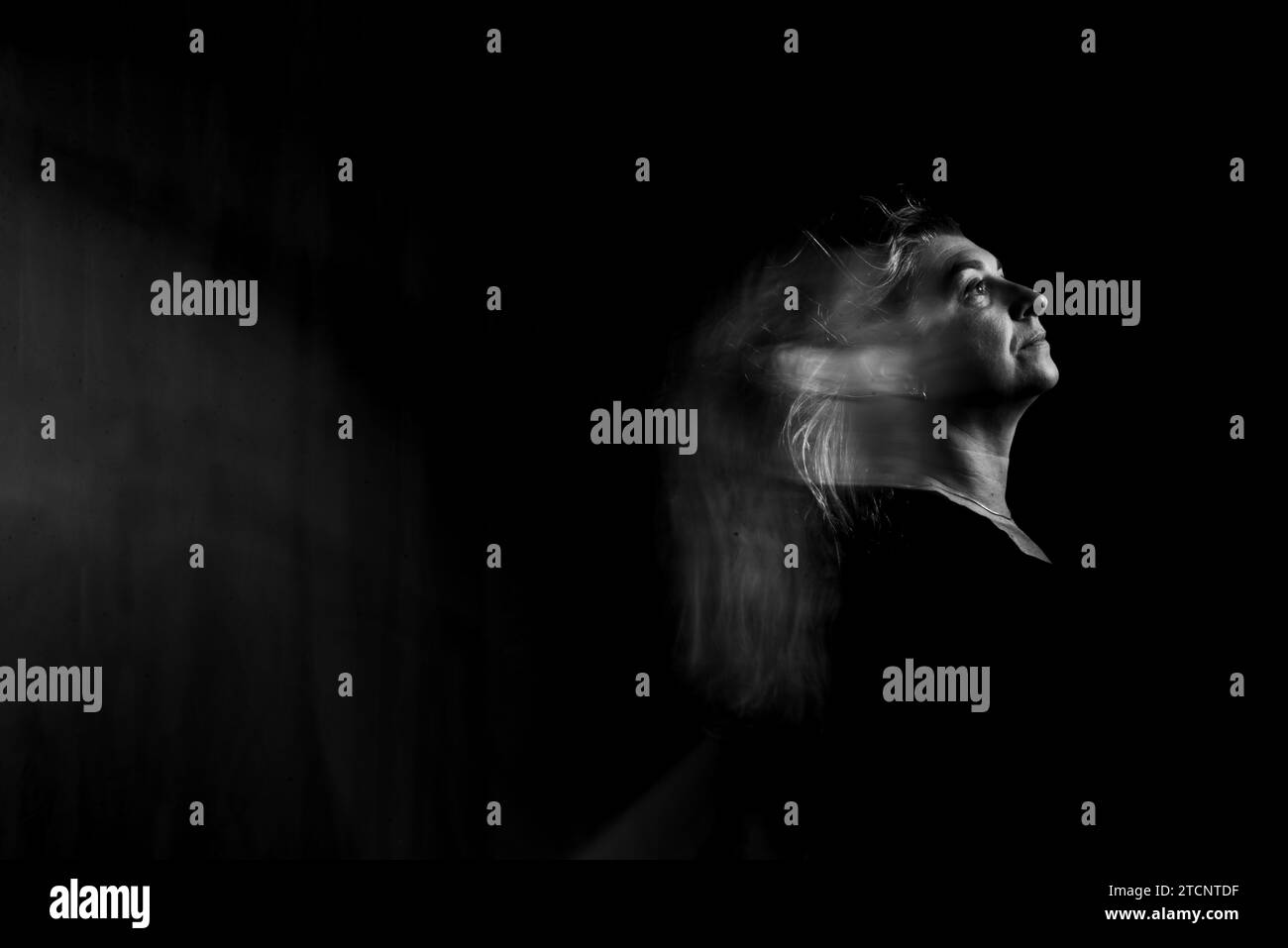 Black and white photo of woman performing in abstract performance with ...