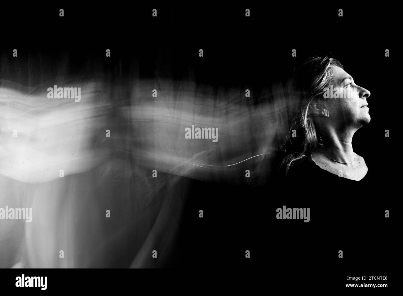 Black and white photo of woman performing in abstract performance with ...