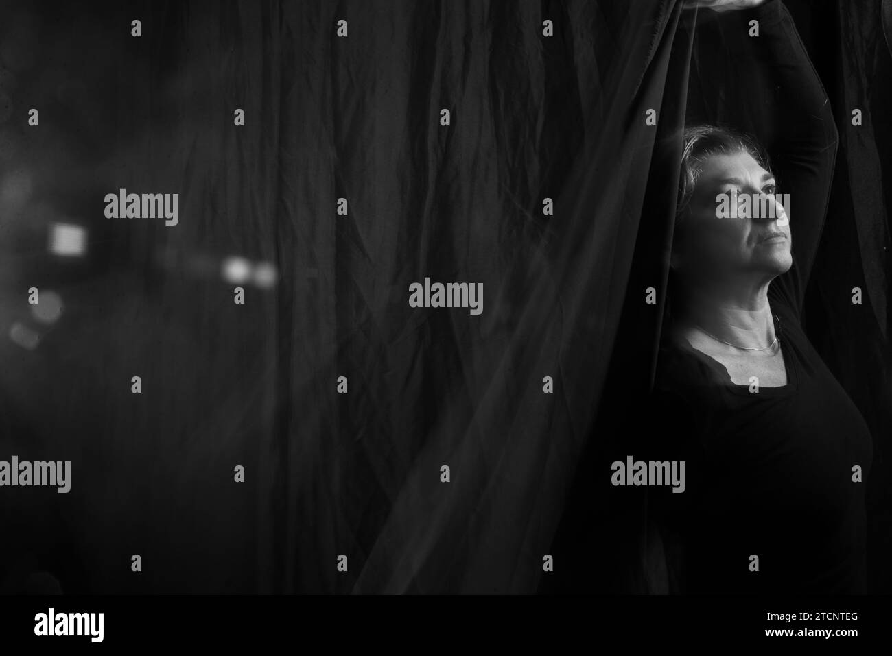 Black and white photo of woman performing in abstract performance with ...