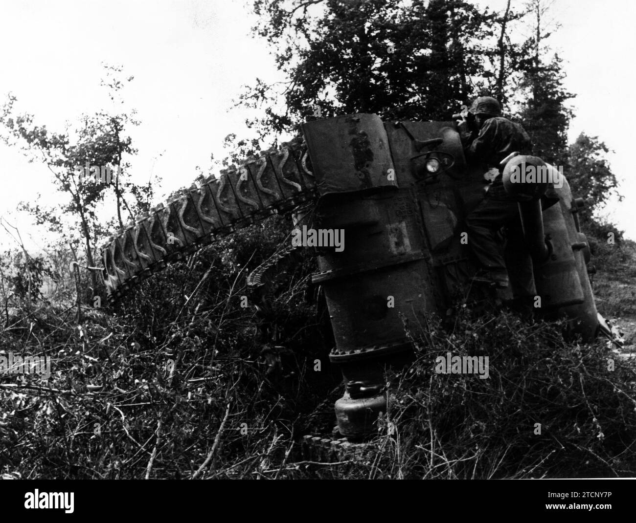 06/30/1944. A German soldier takes cover in an enemy tank in the Caen ...
