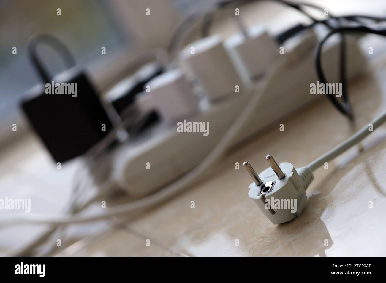 Overloaded power boards. Power strips with different electrical plugs ...