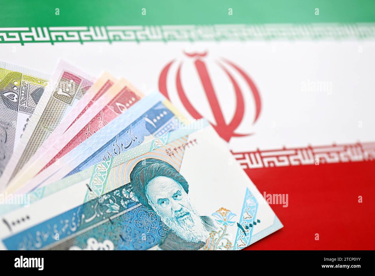Iranian Rial IRR banknotes from Iran on flag of Islamic Republic of ...