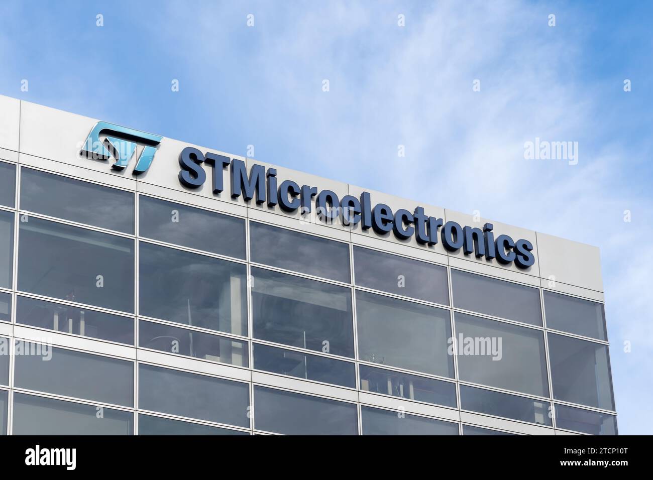 Close up of STMicroelectronics logo and sign on the office building in ...