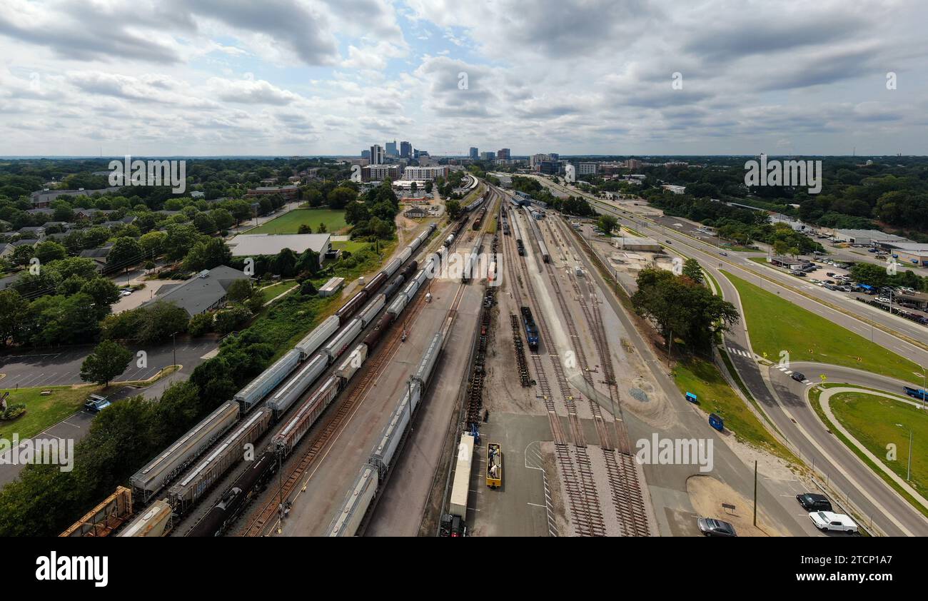 drone photos of various rail cars and amtrak trains on a cloudy day in ...