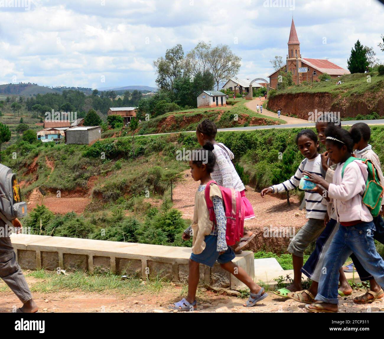 School children walking on the road in Ambatofotsy, Madagascar Stock ...