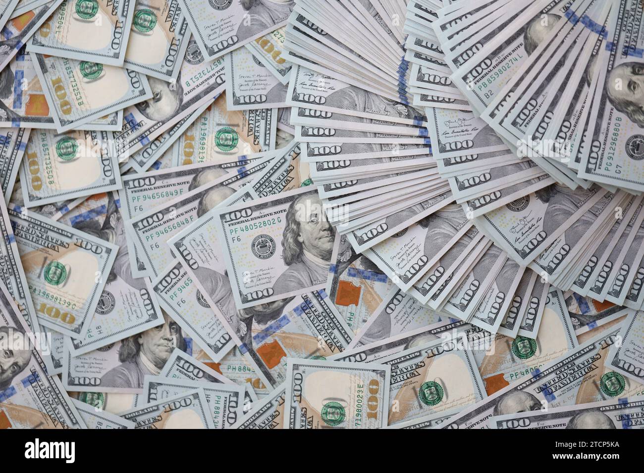 Very big amount of US hundred dollar bills close up. Huge quantity of ...