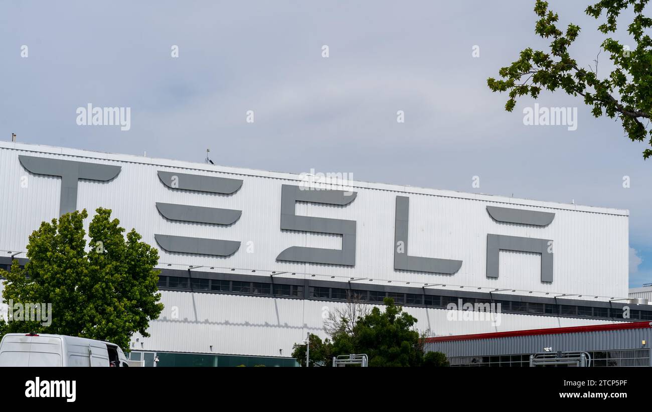 Tesla closeup logo sign on the building at Tesla Motors Center in ...