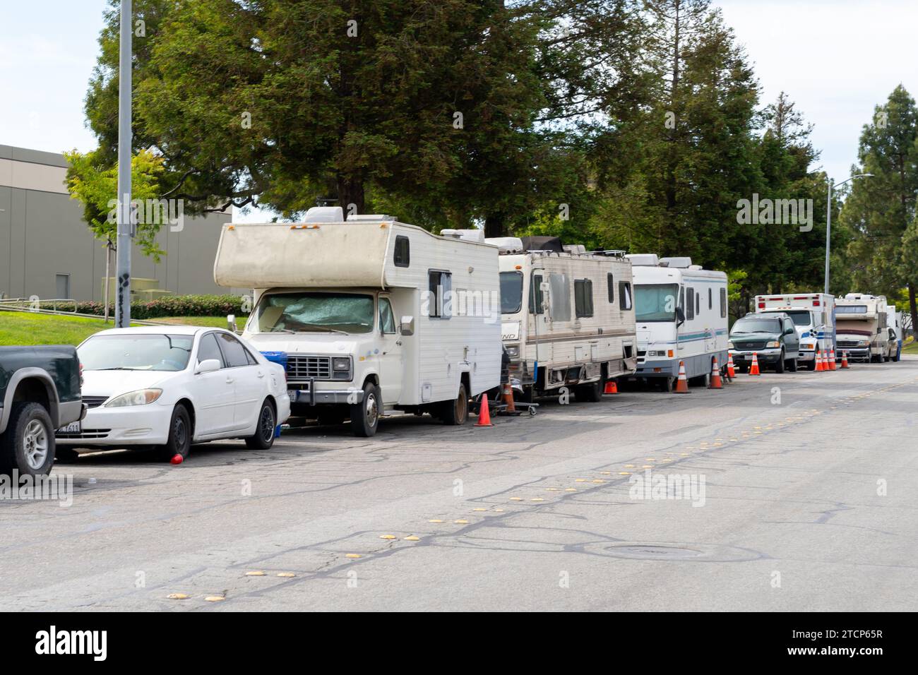 RVs and trailers are parked along the street in Fremont, California ...