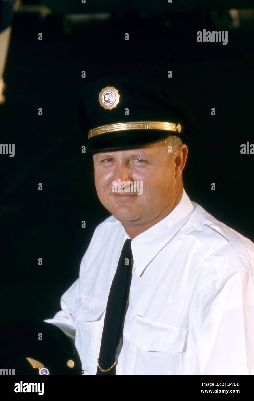 MIAMI, FL - 1958: An unidentified pilot for National Airlines poses for ...