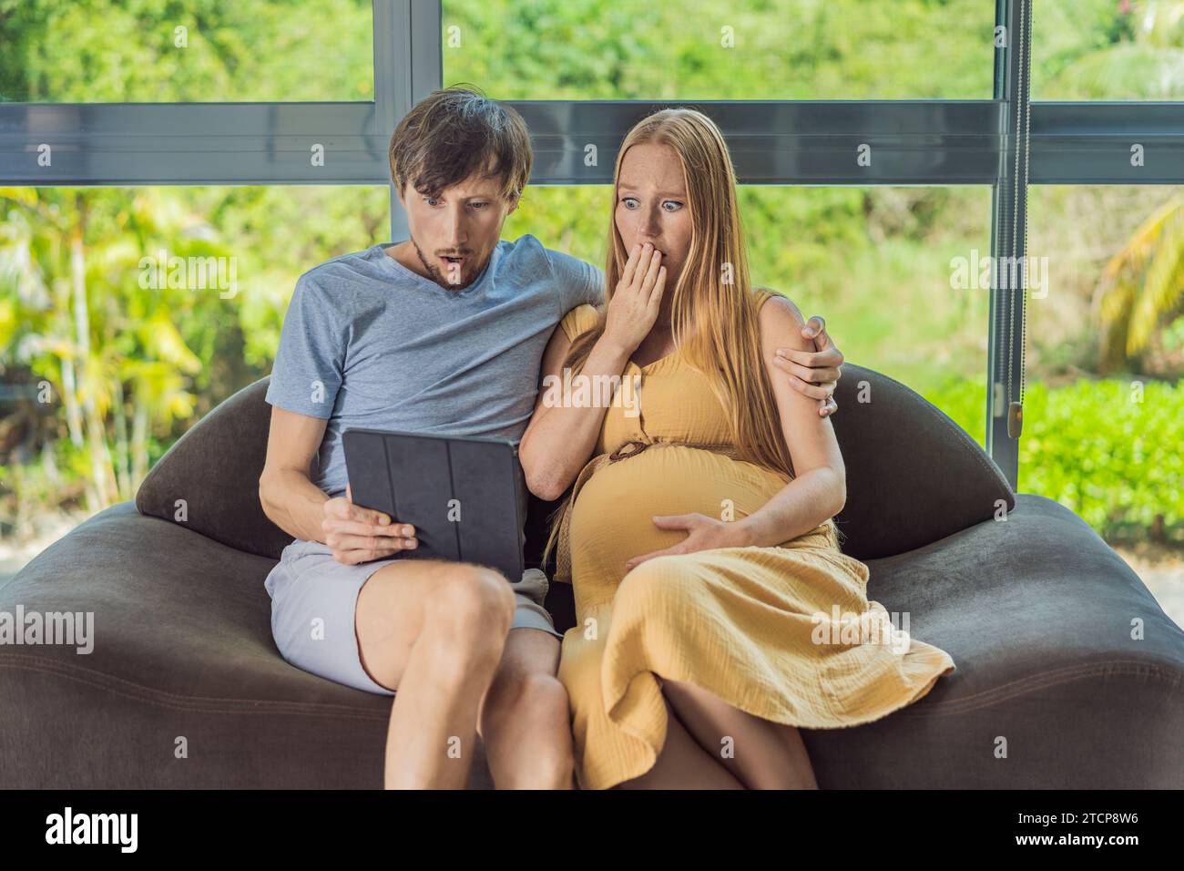 Cost of Pregnancy And Family Budgeting Concept. Young couple expecting ...