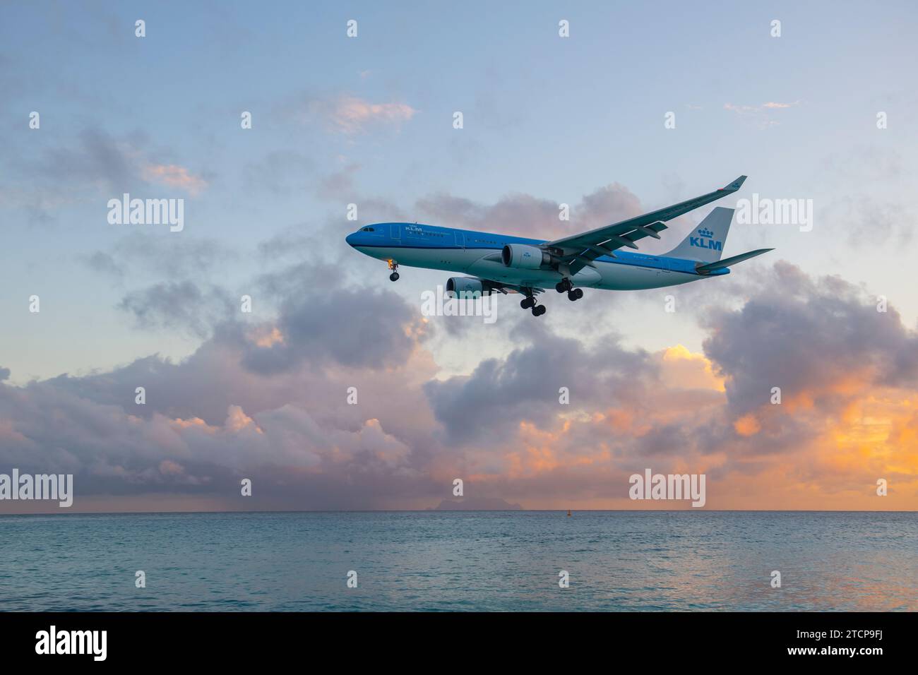 KLM Airbus 330 flying over Maho Beach before landing on Princess ...