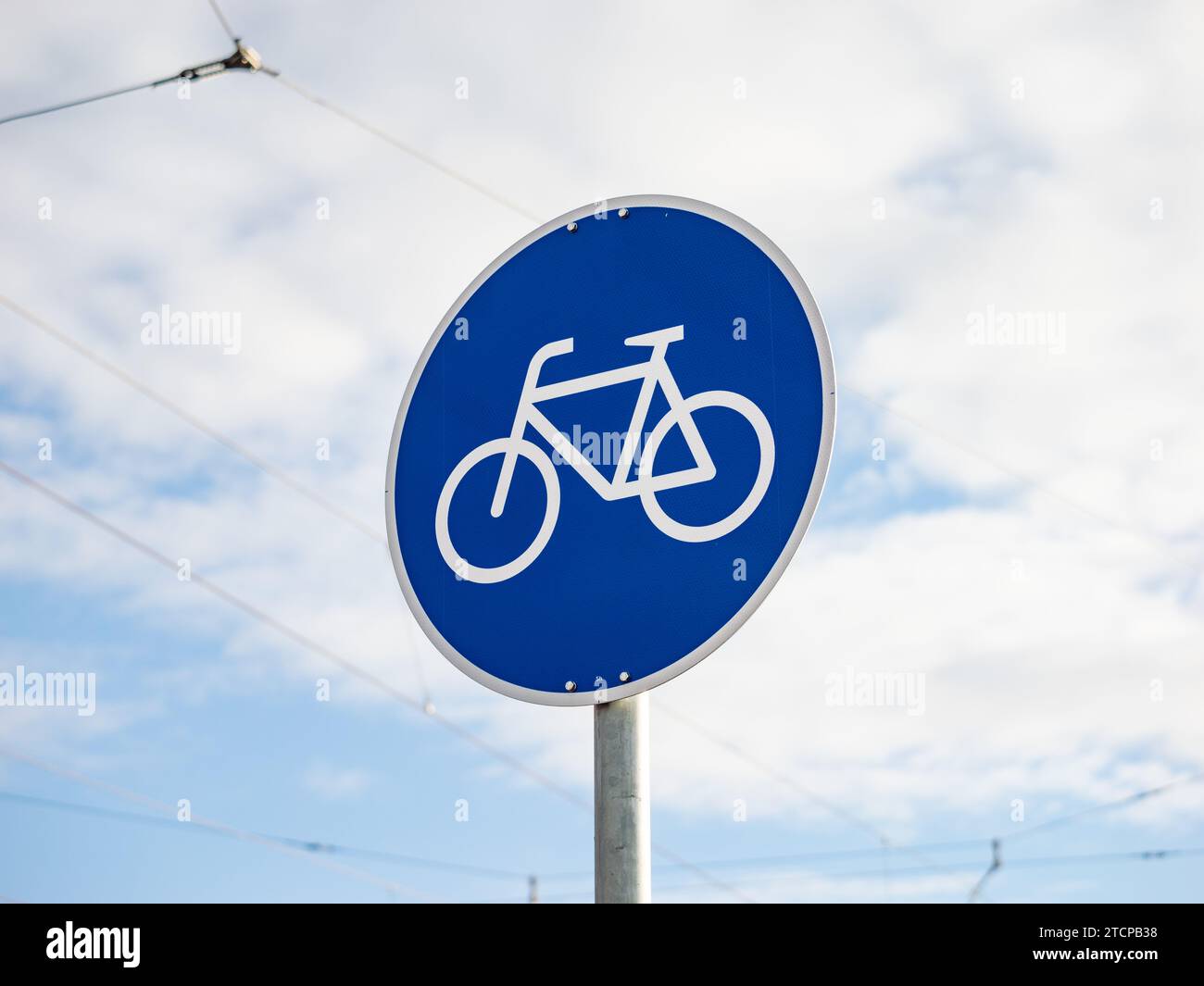 Cycle path sign close up in Germany. The white bicycle is on a blue ...