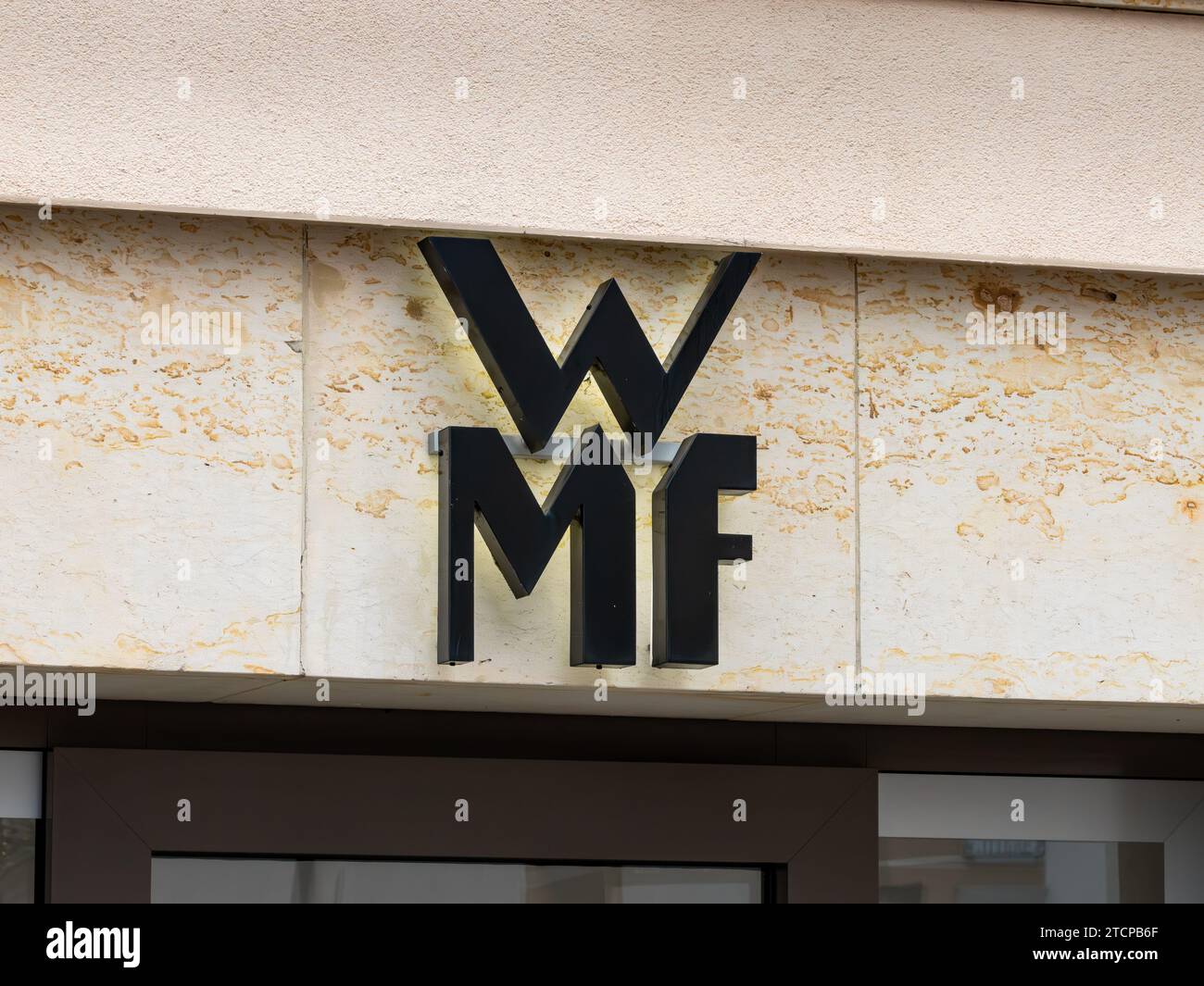 WMF logo sign of the German tableware manufacturer on a store facade. Close up of the icon on a ...