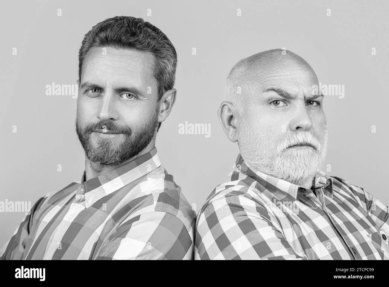 portrait of two generation family men in studio. two generation family ...