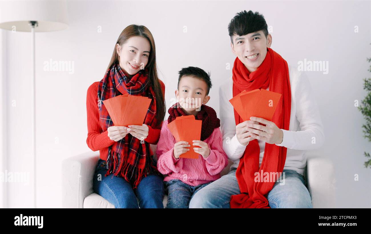happy chinese new year. asian family showing red envelope for ...