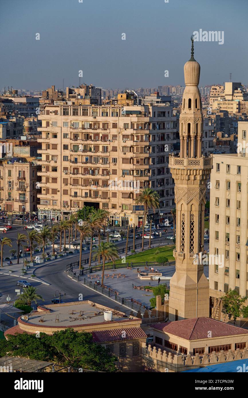 An aerial view of Tahrir Square in Cairo at night, featuring a brightly ...