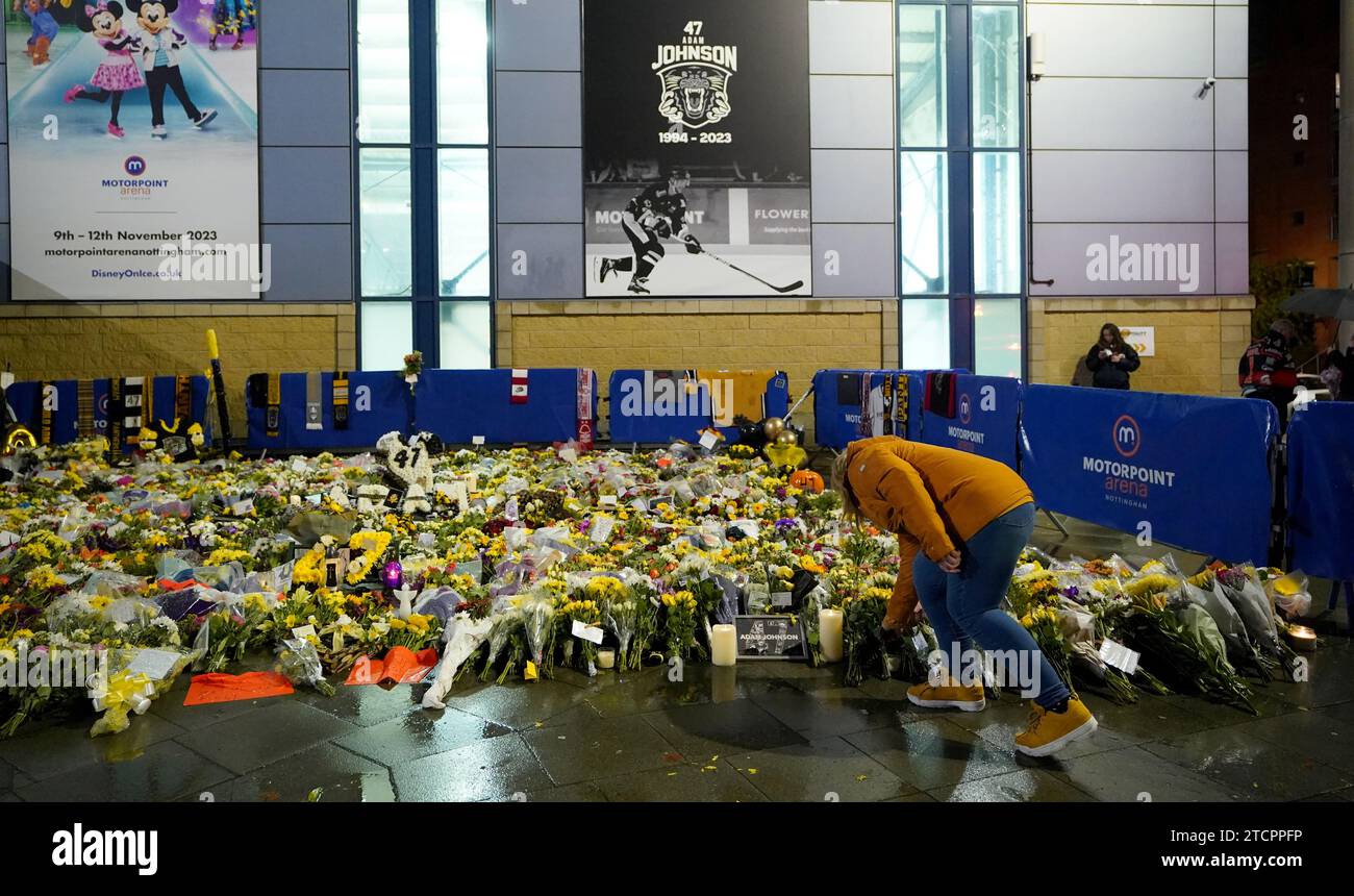 File photo dated 4-11-2023 of fans looking at floral tributes outside ...