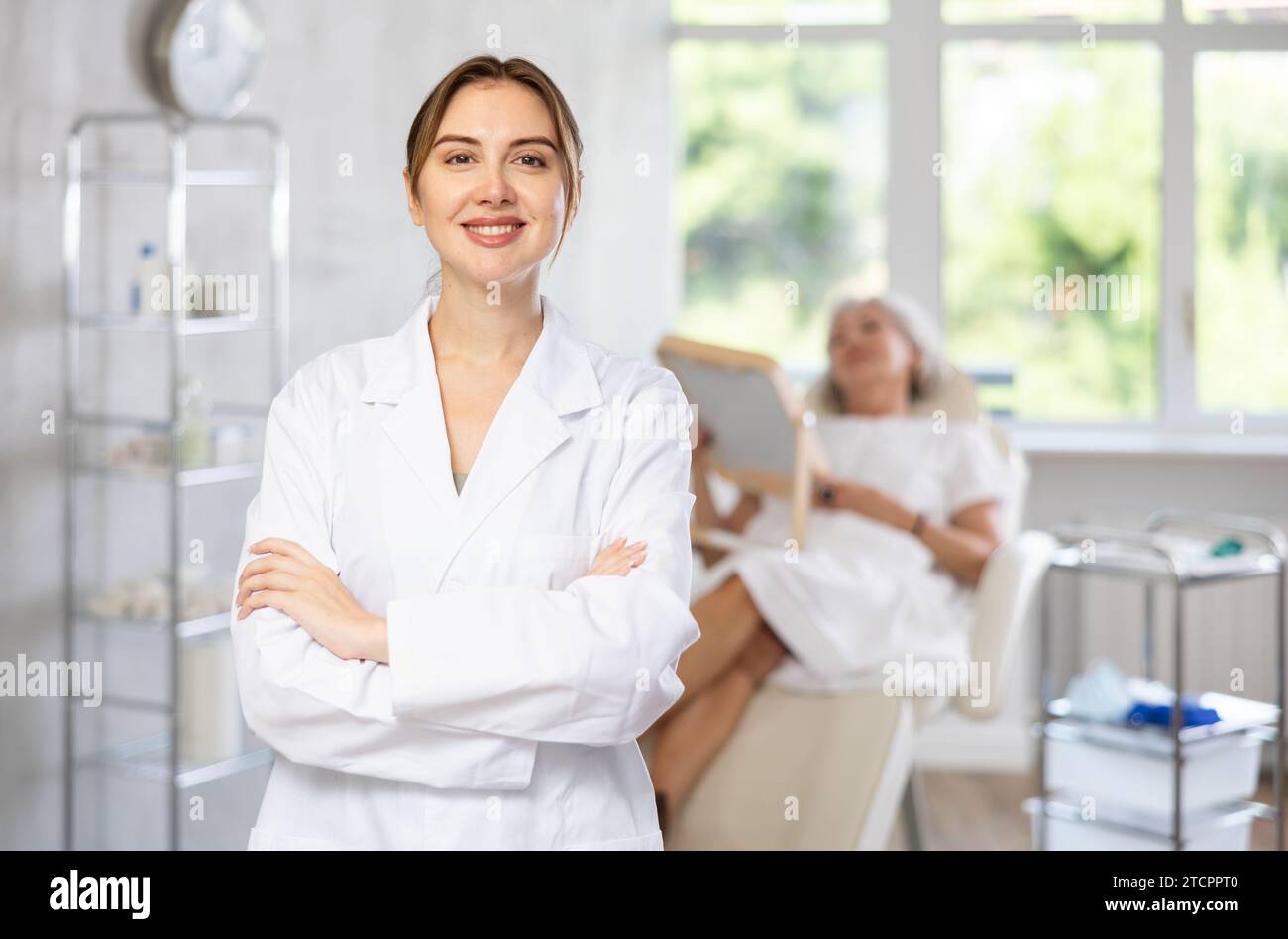 Portrait of young female doctor in scrub Stock Photo - Alamy