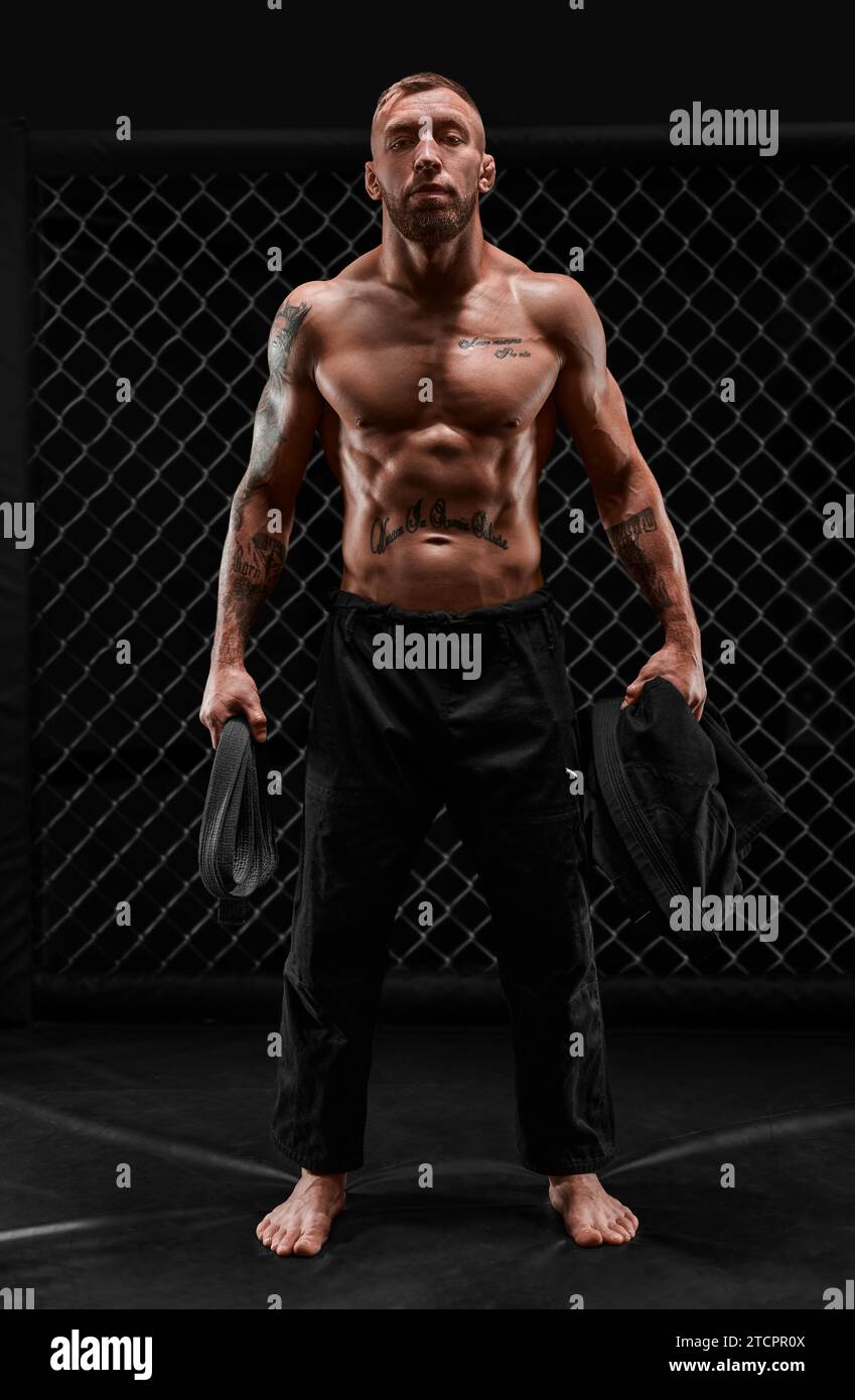 Conceptual image of a karate athlete. A real fighter stands in the real ...