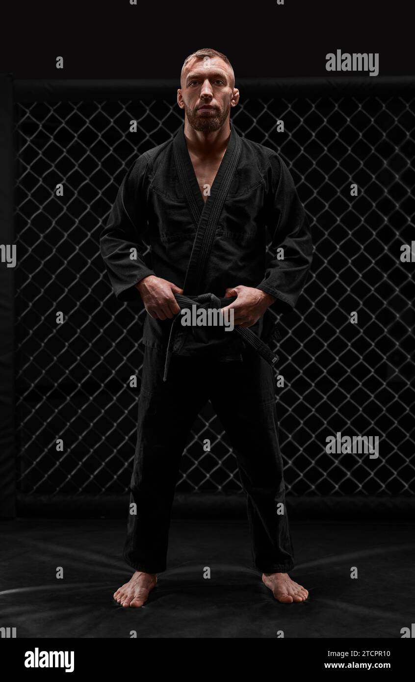 Conceptual image of a karate athlete. A real fighter stands in the real ...
