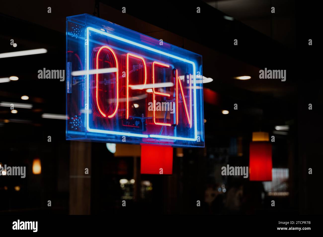 A colorful neon sign declaring the restaurant open Stock Photo - Alamy