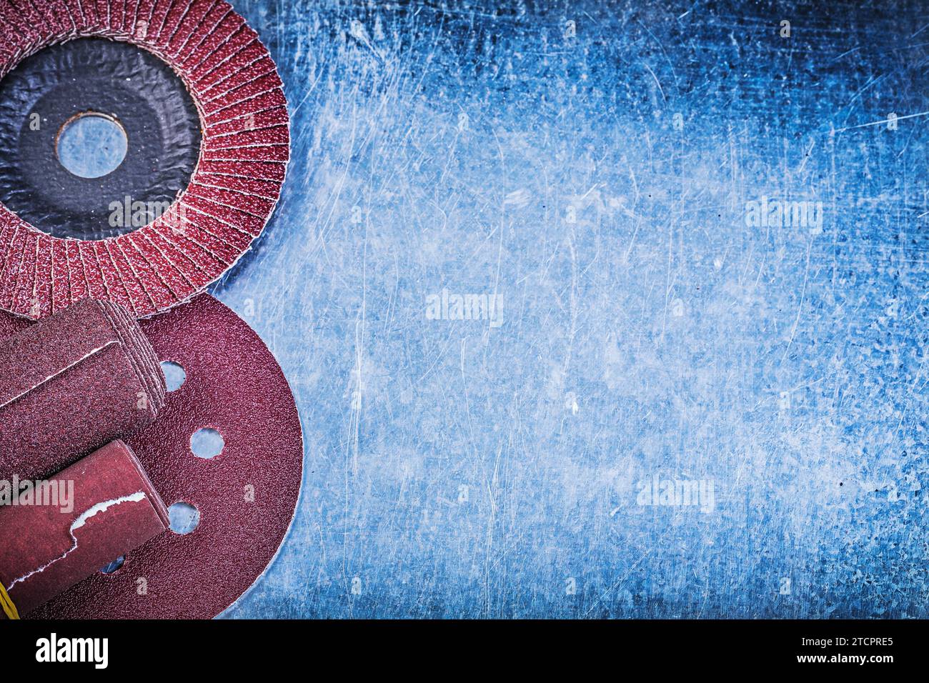 Sanding flap disc Sanding paper rolls on metallic background Copying ...