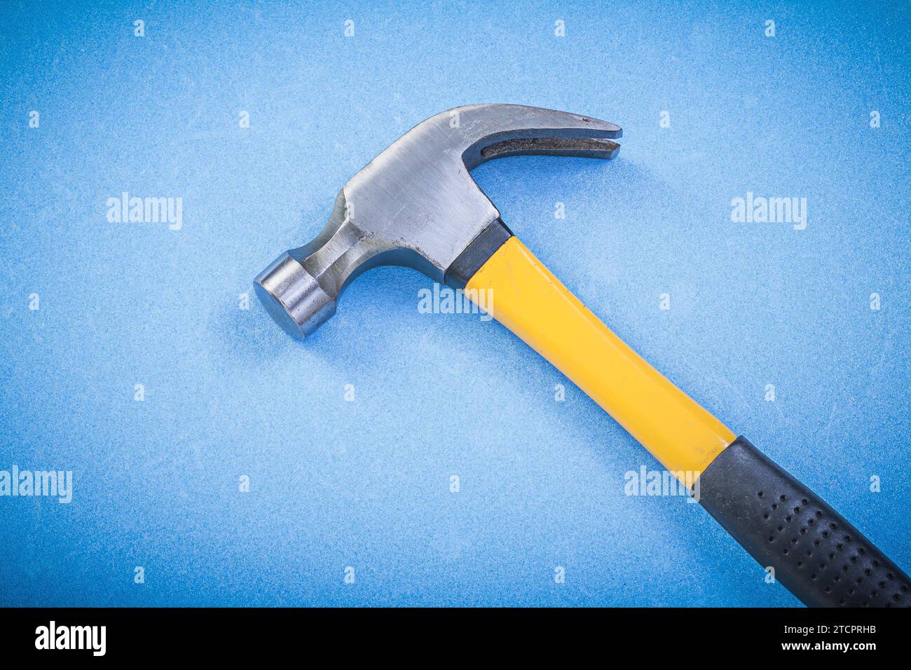 Claw hammer on blue background Building concept Stock Photo - Alamy
