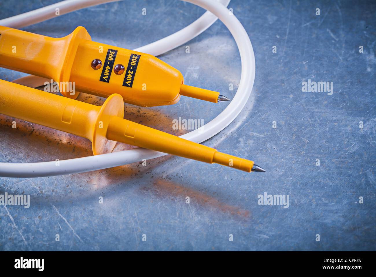 Electrical tester on metallic background Electricity concept Stock ...