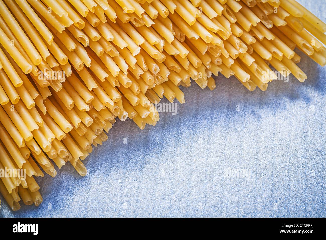 Pile of spaghetti on a blue background Food and drink concept Stock ...