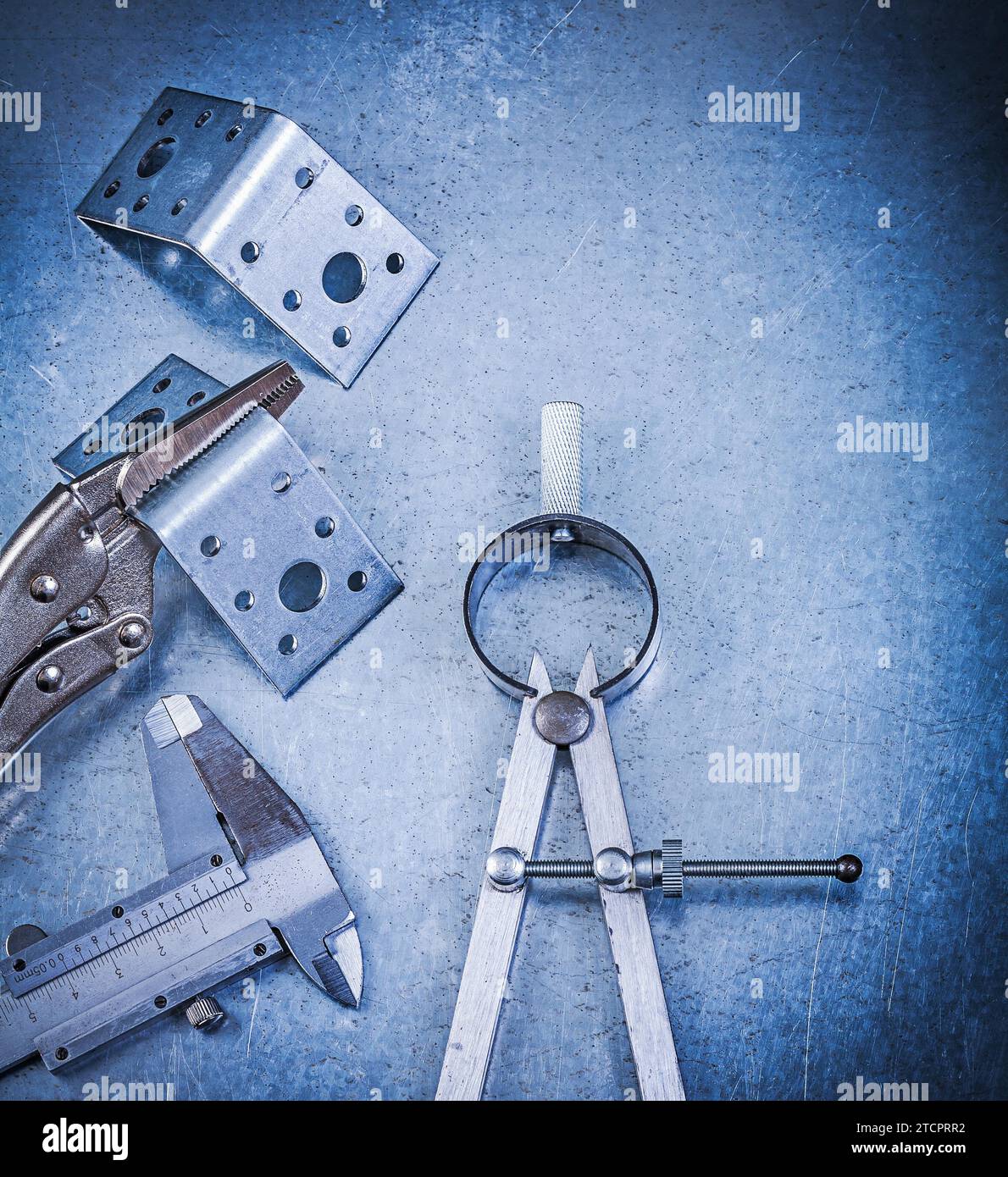 Metal locking pliers with jaws Calipers Drilled angle bars Building ...