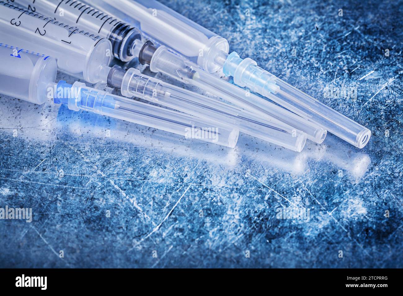 Pile of medical syringes on metallic background medicine concept Stock ...