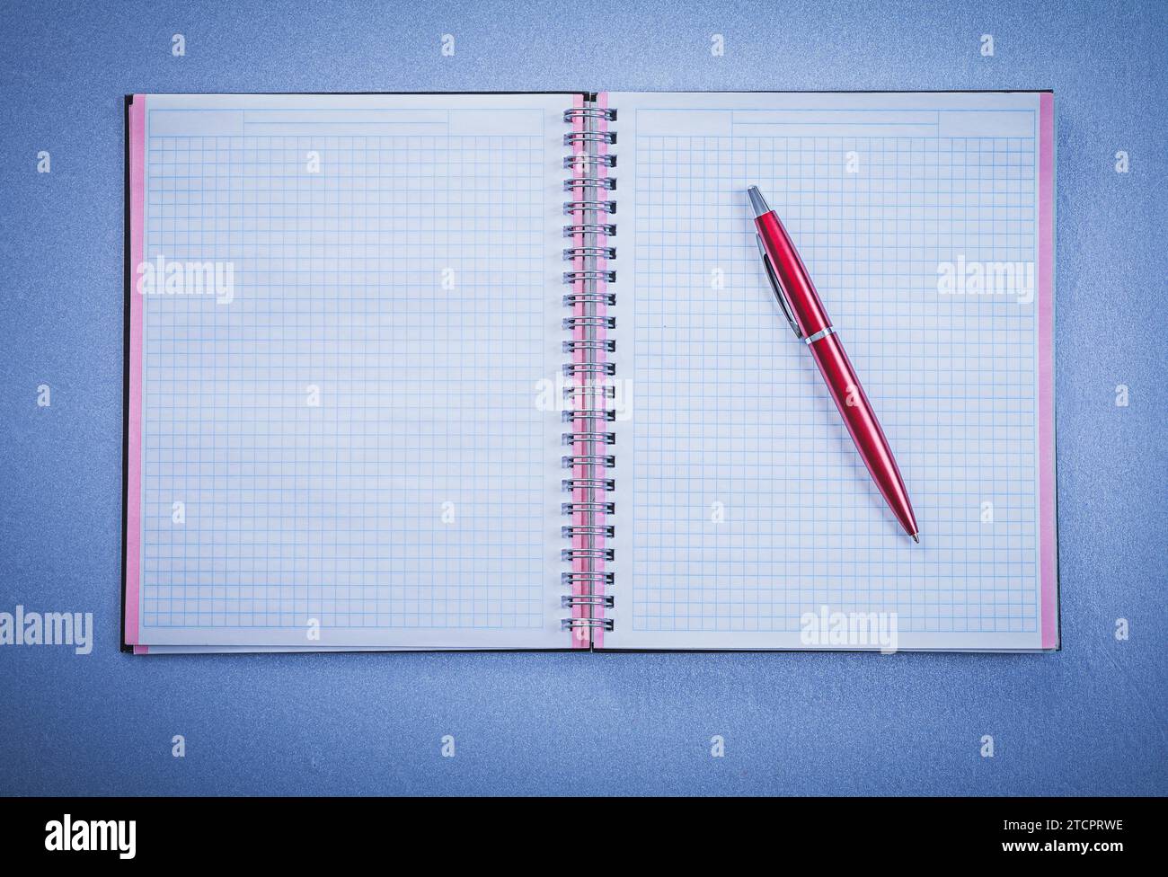 Set of red ballpoint pens open copybook office concept Stock Photo - Alamy