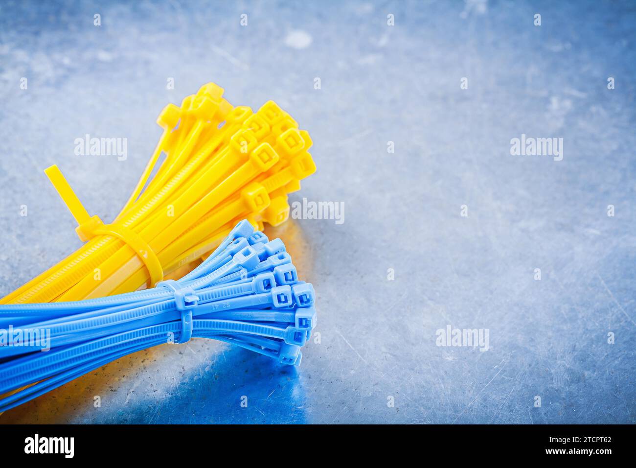 Assortment of plastic binding cables on a metallic background Design ...