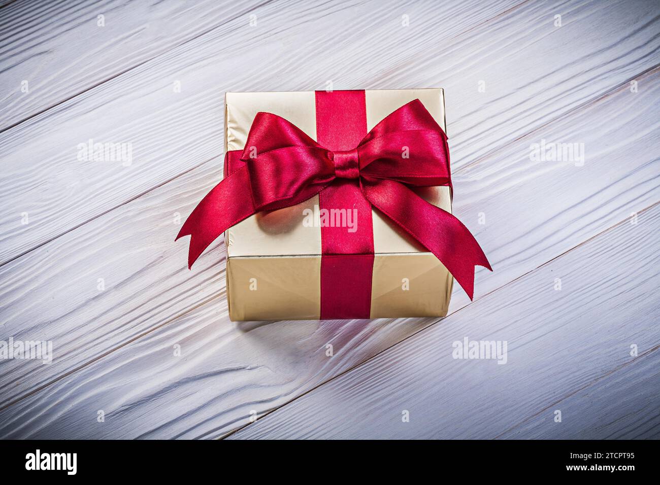 Birthday gift box with red bow on wooden board holiday concept Stock ...