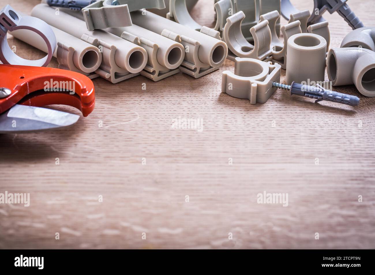 Large set of polypropylene fixators and pipes with clips Pipe cutter on ...