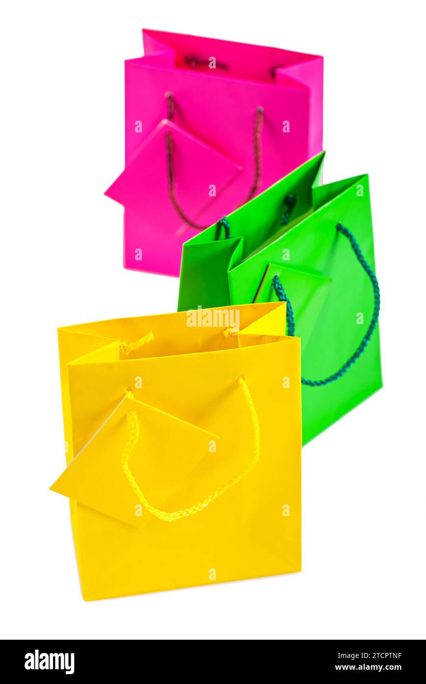 Coloured paper bags isolated on white Stock Photo - Alamy