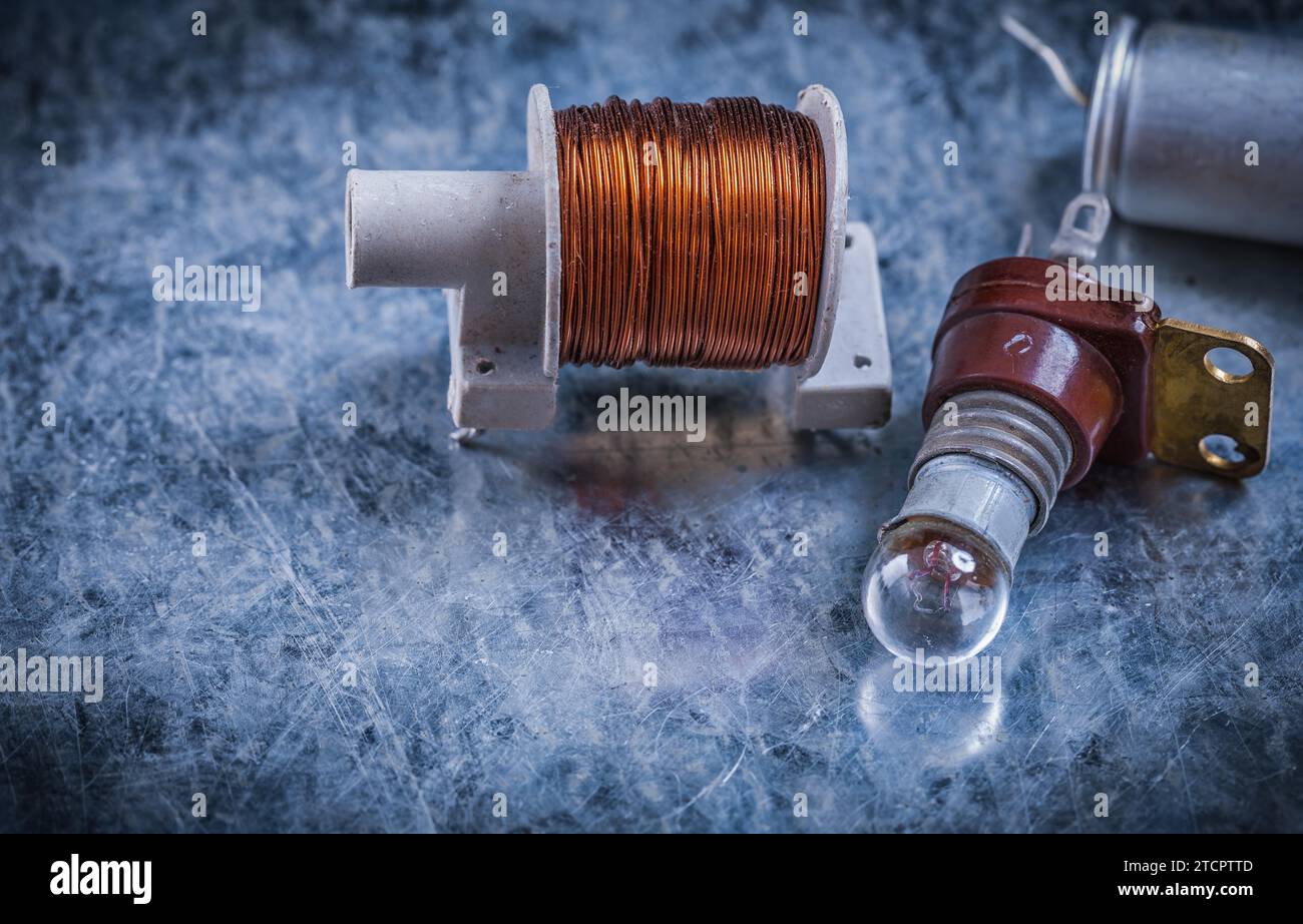 Electrical capacitor switch transformer lamp socket on scratched ...