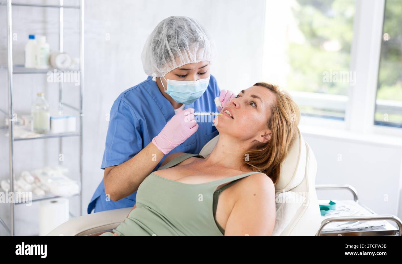 Qualified female beautician client hi-res stock photography and images ...