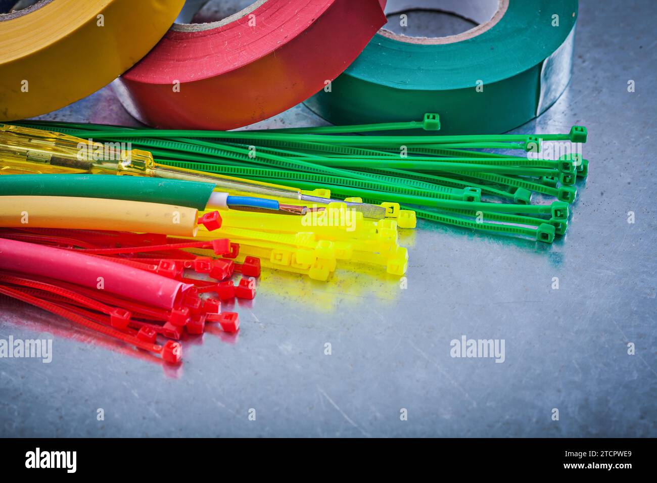 Insulating tapes Plastic cable ties Electrical wires on a metallic ...