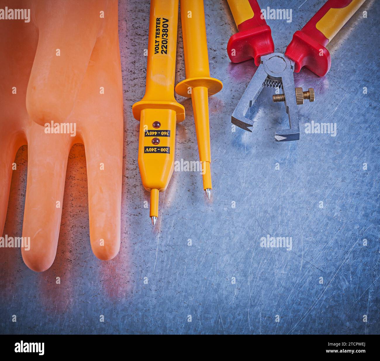 Insulating gloves Stripping pliers Electrical testing device on ...