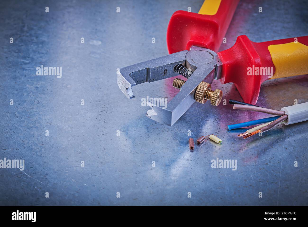 Insulated wire strippers electrical wires on scratched metallic ...