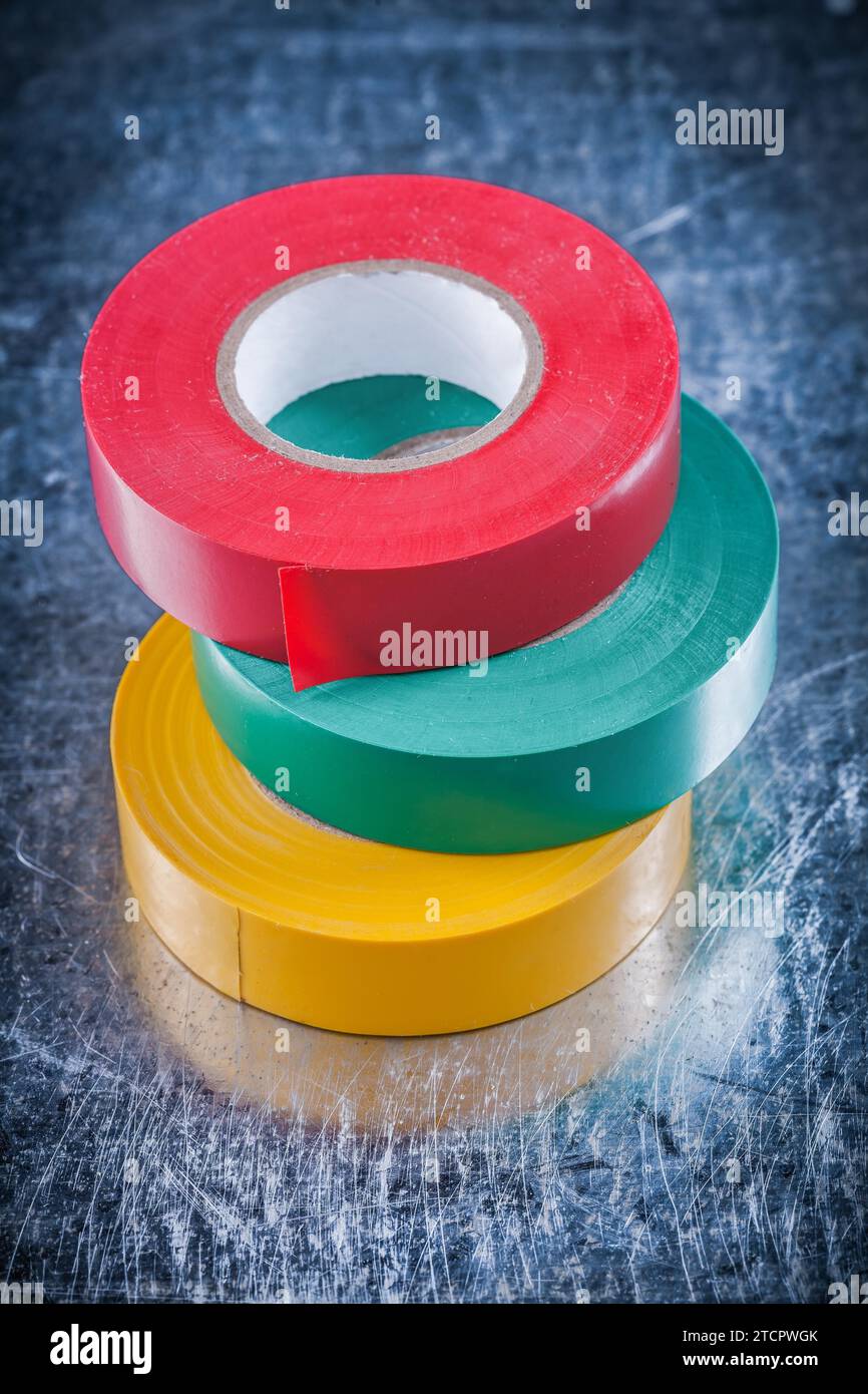 Insulating tapes on scratched metallic background Electricity concept ...