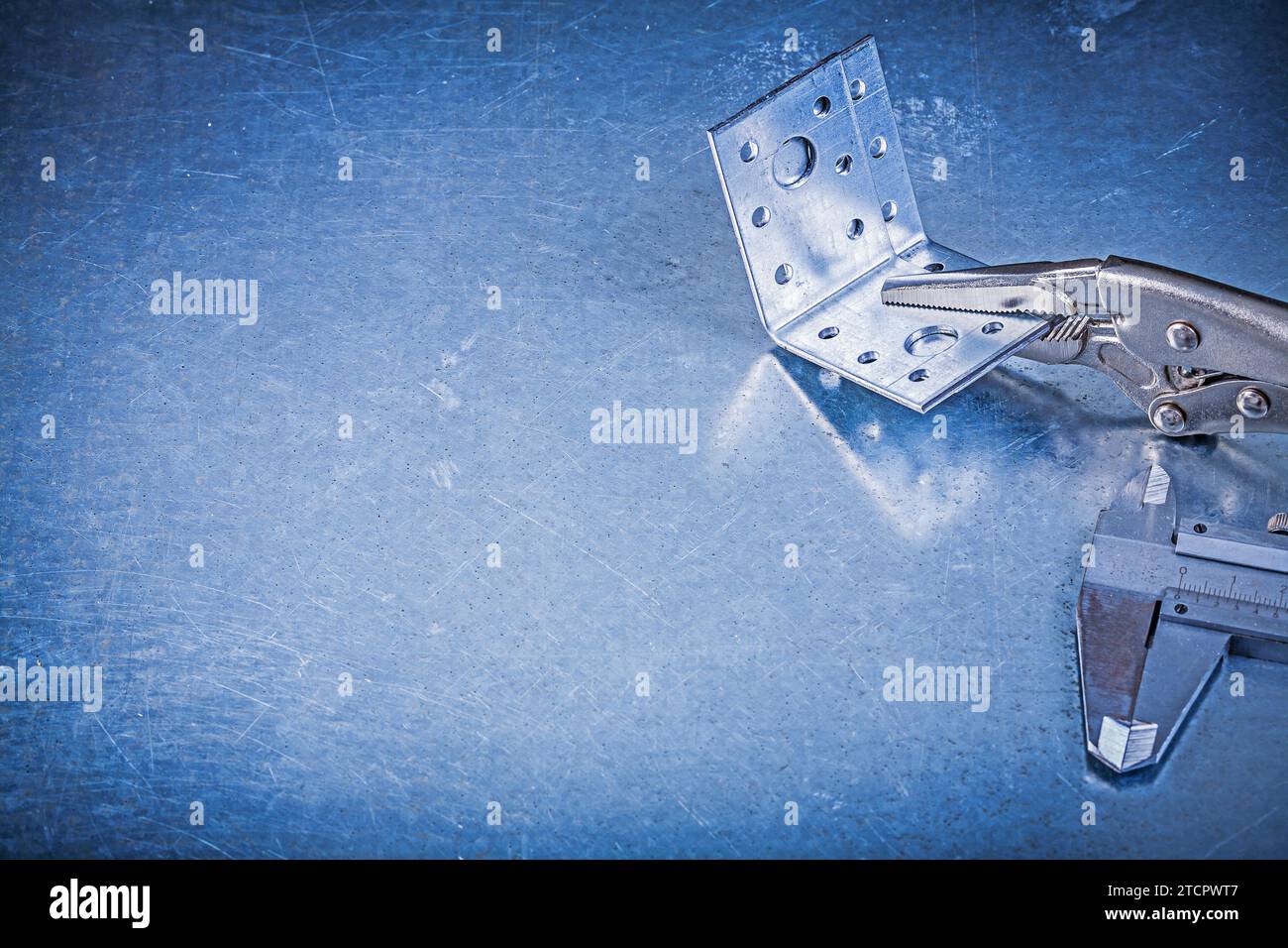 Metal locking pliers with jaw slide Angled bars on a metallic ...