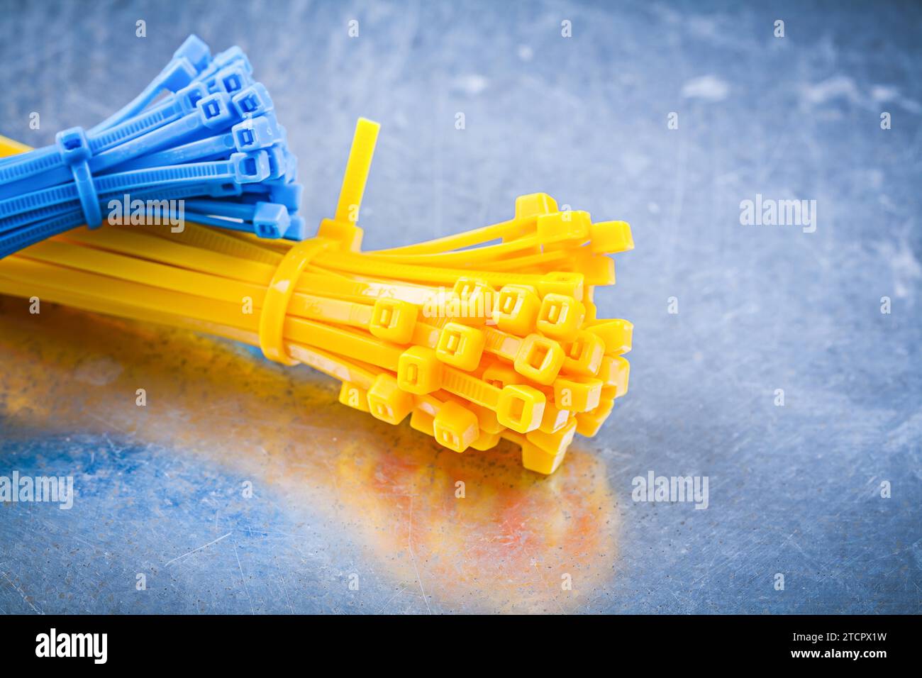 Plastic binding cable on scratched metallic background Design concept ...