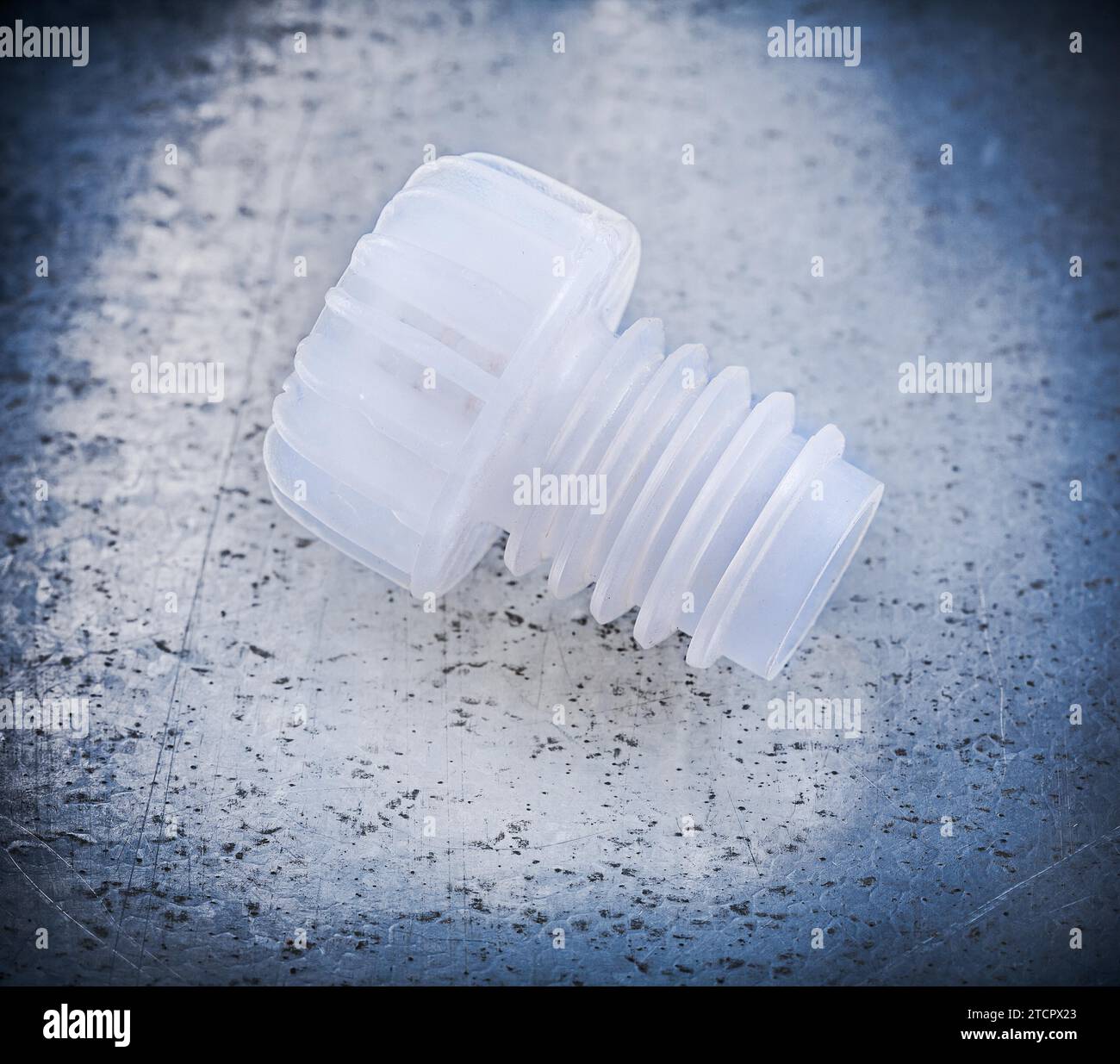 Plastic cork tap on a metallic background Stock Photo - Alamy