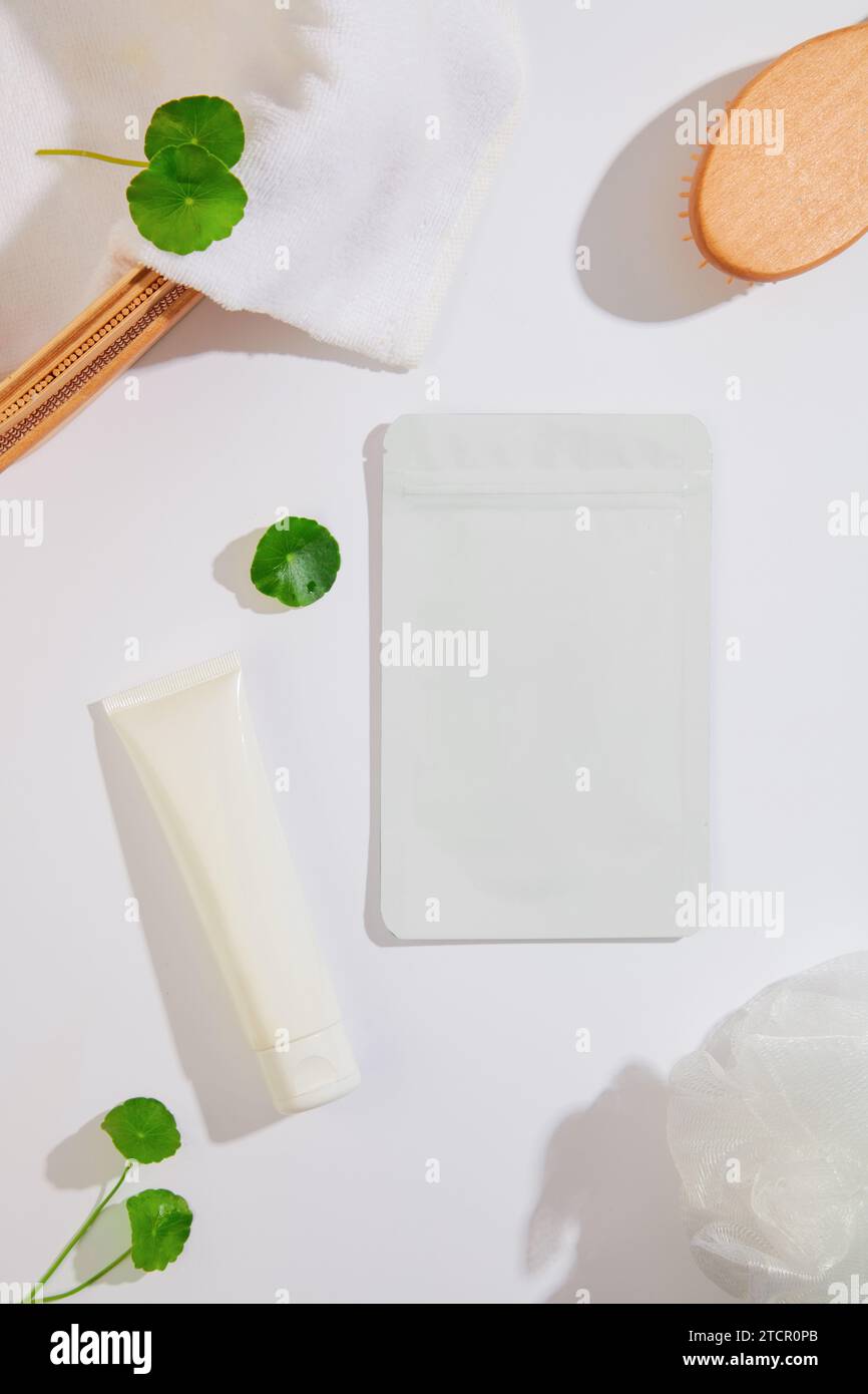 Unlabeled cosmetic set includes a mask and a tube of lotion on a white ...