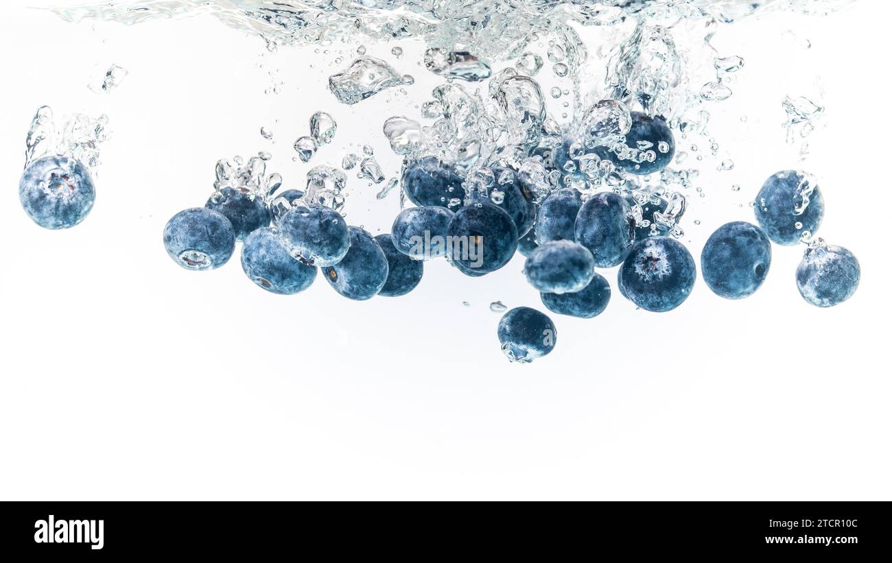Blueberry?s splashing into crystal clear water with air bubbles Stock ...