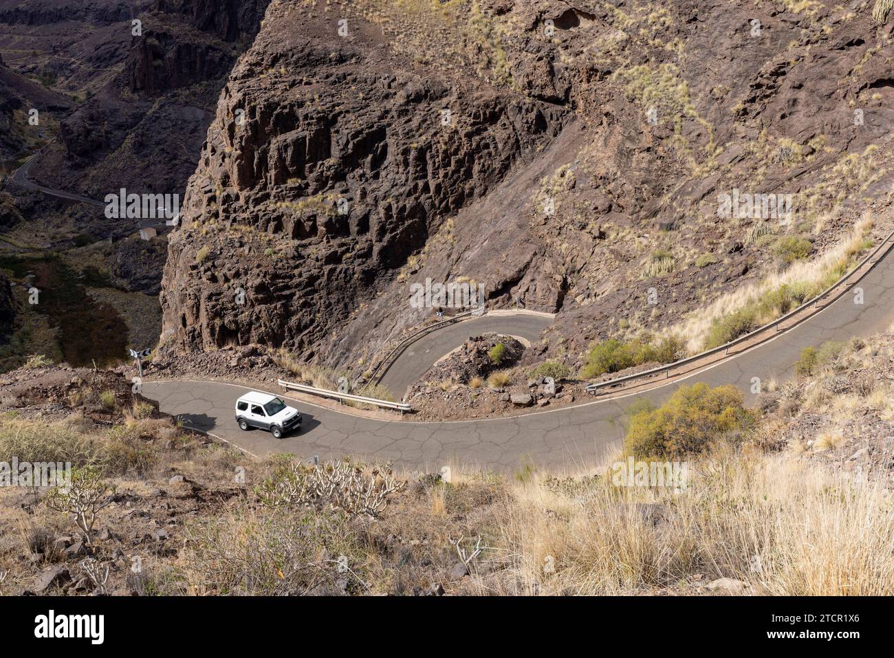 Jeep driving on narrow mountain road GC-210, Artenara, Gran Canaria ...